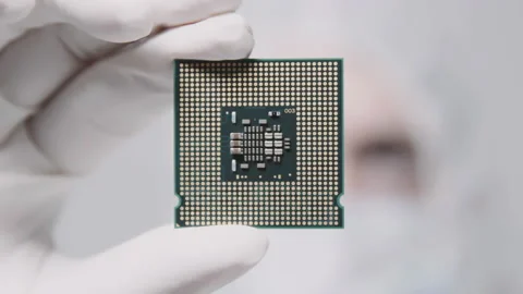 Engineer in Cleanroom suit holds CPU pro... | Stock Video | Pond5