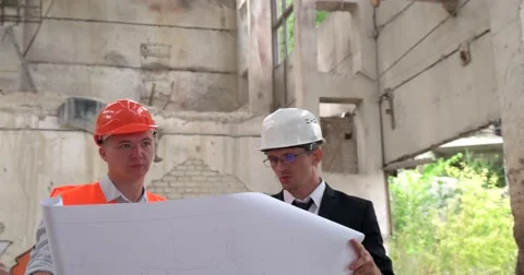 Engineer at a construction site with blu... | Stock Video | Pond5