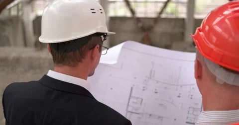 Engineer at a construction site with blu... | Stock Video | Pond5