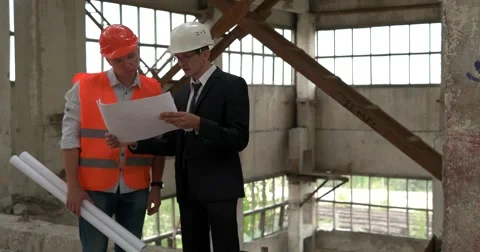 Engineer at a construction site with blu... | Stock Video | Pond5