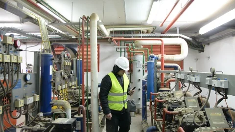 Engineer looking at the high pressure ai... | Stock Video | Pond5