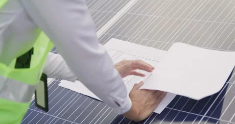 Engineer open blueprint of solar farm pr... | Stock Video | Pond5