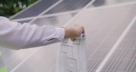 Engineer open blueprint of solar farm pr... | Stock Video | Pond5