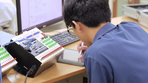 Engineering Student Taking Notes on a Ta... | Stock Video | Pond5