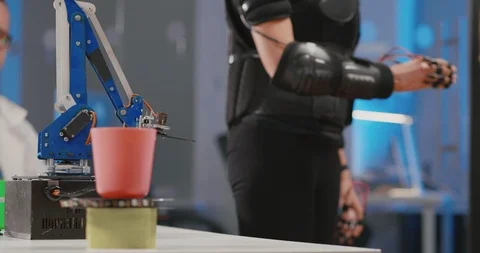 Engineers making experiment with exoskel... | Stock Video | Pond5