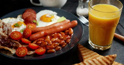English Breakfast of bacon, eggs and bea... | Stock Video | Pond5
