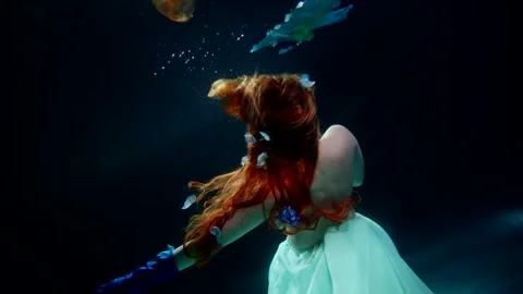 enigmatic female figure underwater, back... | Stock Video | Pond5