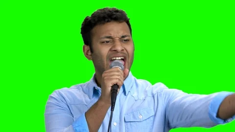 Enthusiastic man singing with microphone... | Stock Video | Pond5