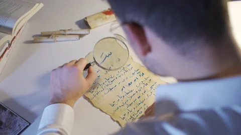 The epigraphist examines the letter writ... | Stock Video | Pond5