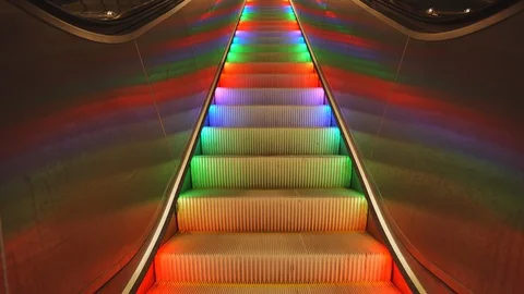 Escalator with multi-colored LED rainbow... | Stock Video | Pond5