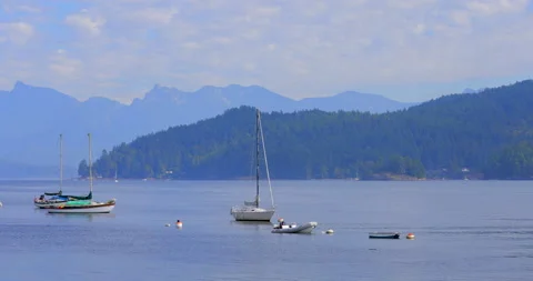 Establishing shot of ocean beach with ro... | Stock Video | Pond5
