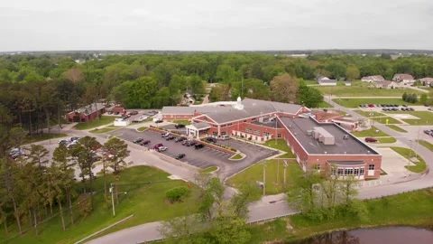 Establishing side view of red brick hosp... | Stock Video | Pond5