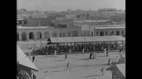 ETHIOPIA - 1935 - People wait at a bus s... | Stock Video | Pond5