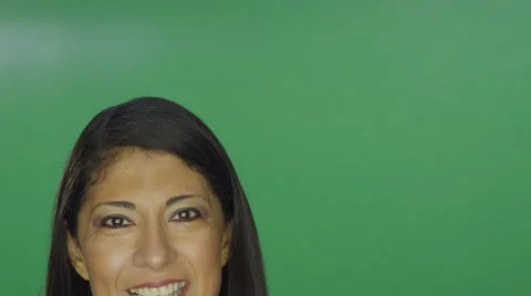 Ethnic woman smiling, on a green screen ... | Stock Video | Pond5