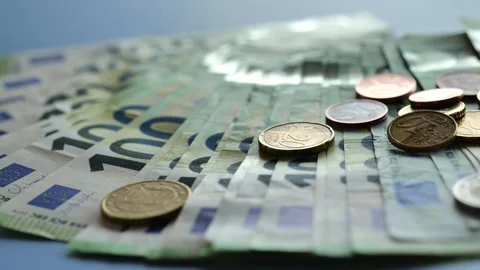 Euro cents falling on a one hundred euro... | Stock Video | Pond5