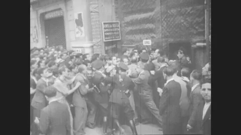 Europe 1940s: crowds push through lines.... | Stock Video | Pond5