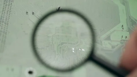 Examining the details of an electronic b... | Stock Video | Pond5