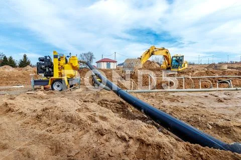 Excavator dig the trenches at a construction site. Trench for laying ...