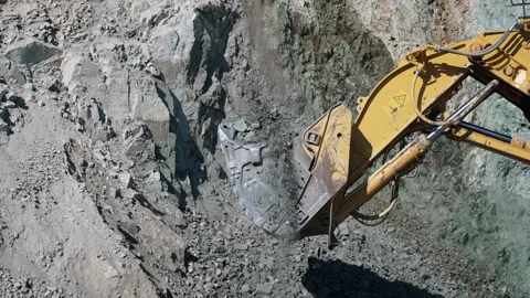 Excavator digger digging limestone in op... | Stock Video | Pond5