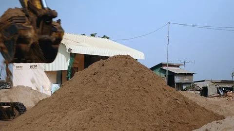 Excavator discharging and piling up sand... | Stock Video | Pond5