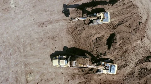 Excavators loading soil onto an Articula... | Stock Video | Pond5