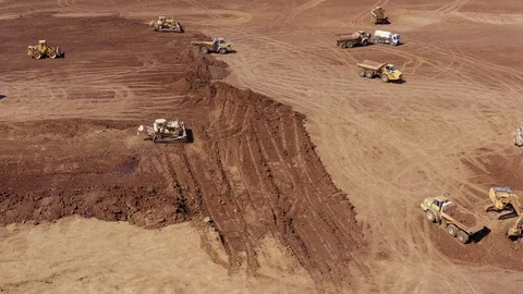 Excavators loading soil onto an Articula... | Stock Video | Pond5