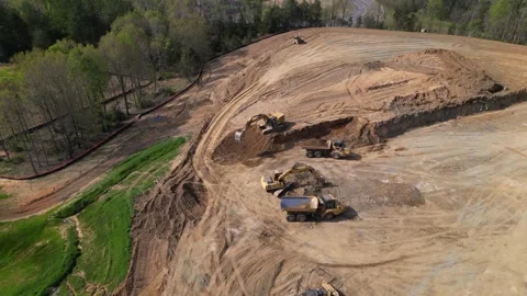 Excavators loading soil onto an Articula... | Stock Video | Pond5