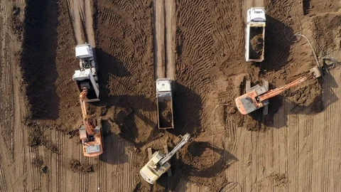 Excavators loading Trailer Trucks with a... | Stock Video | Pond5