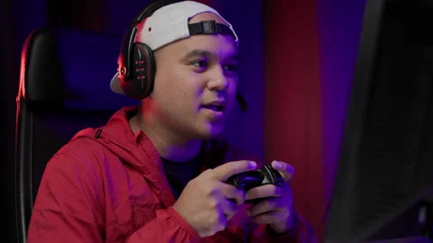 Excited and shocked face of Asian gamer ... | Stock Video | Pond5