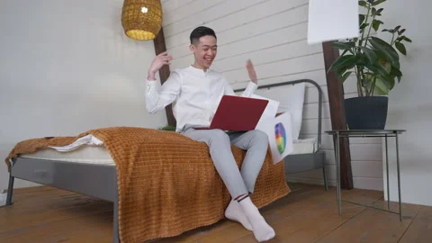 Excited Asian young man throwing up grap... | Stock Video | Pond5