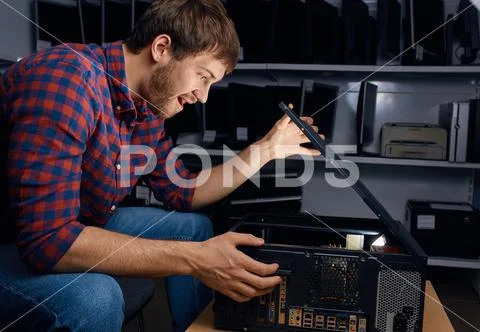 Excited emotional man opening the system unit Stock Image #137125876