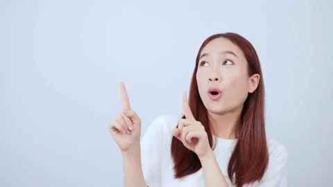 Excited long-haired woman with and point... | Stock Video | Pond5