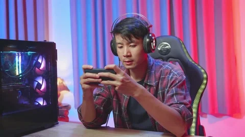 Excited Male Gamer Playing Game On Mobil... | Stock Video | Pond5