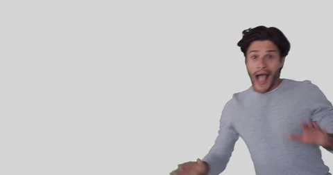 Excited man waving both hands on white b... | Stock Video | Pond5