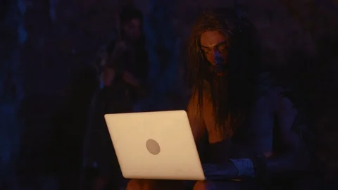 Excited primitive man in animal skin usi... | Stock Video | Pond5