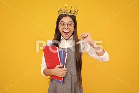 Excited teenager princess in school uniform and crown celebrating ...