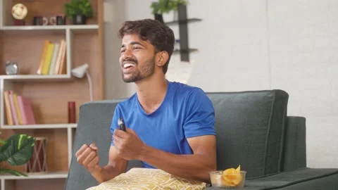 Excited young man shouting by raising ha... | Stock Video | Pond5