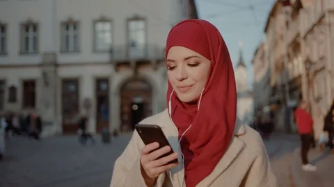 Exciting Muslim young lady enjoying musi... | Stock Video | Pond5