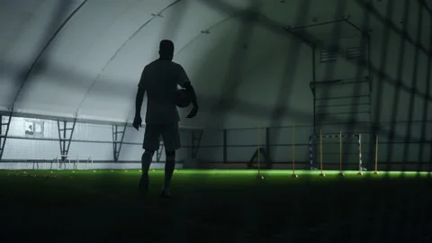 exhausted footballer walking alone on fo... | Stock Video | Pond5