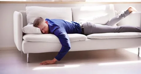 Exhausted Man Falling Asleep On Couch | Stock Video | Pond5