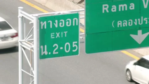 Exit sign on the highway with cars and v... | Stock Video | Pond5