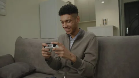 Exited Black Man Playing Video Game Hold... | Stock Video | Pond5