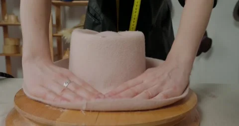 Experienced milliner straightens felt ha... | Stock Video | Pond5