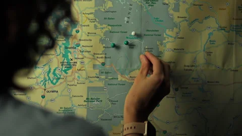 Exploring a map while planning a journey... | Stock Video | Pond5