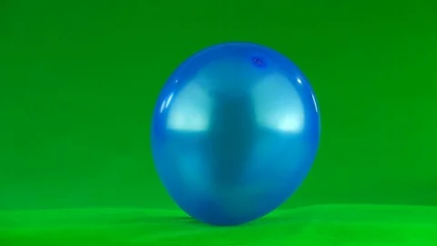 explosion of a blue balloon on a green b... | Stock Video | Pond5