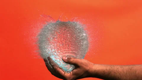 Explosion of Blue Water Balloon in a Pal... | Stock Video | Pond5