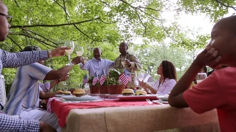 Extended family toasting military man at... | Stock Video | Pond5