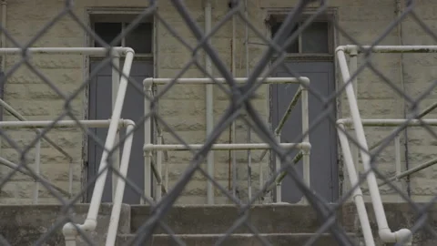 Exterior Of Prison Through Chain Link Fe... | Stock Video | Pond5