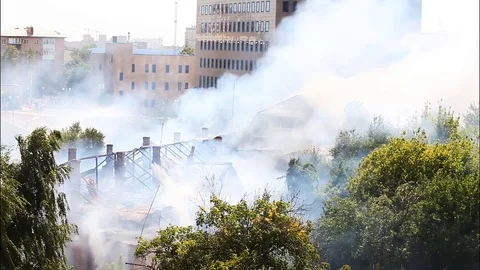 extinguishing a fire at a distance from ... | Stock Video | Pond5