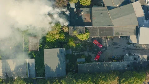 Extinguishing a fire in a warehouse by a... | Stock Video | Pond5